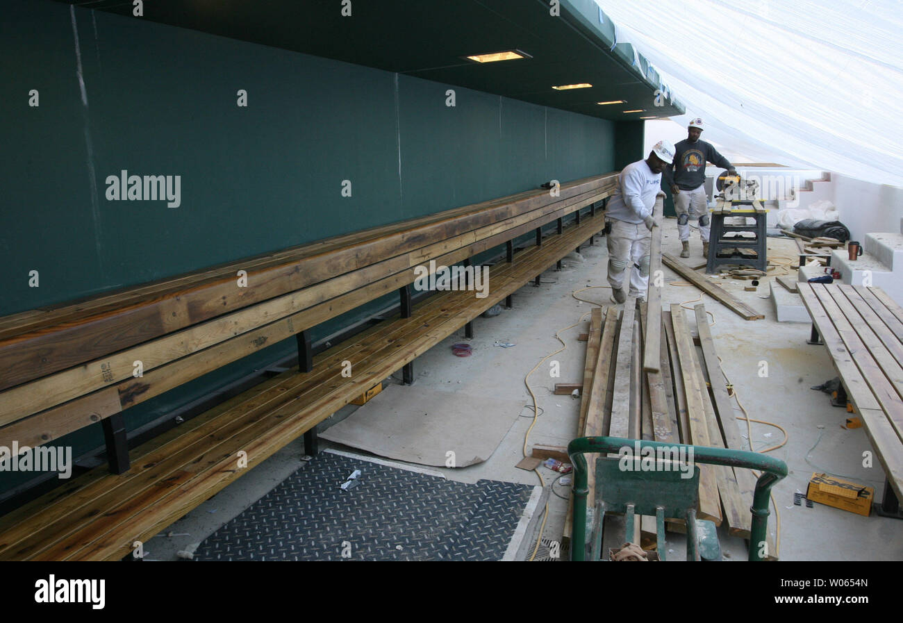 Workers finish installing the wooden boards that will makeup the ...
