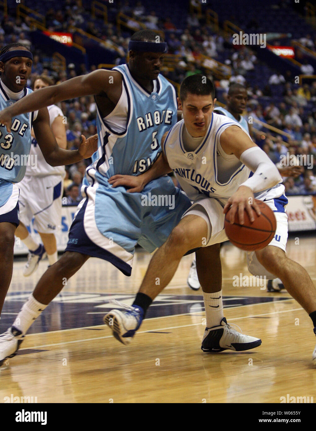 Saint Louis University's Kevin Lisch (R) tries to dribble past the ...