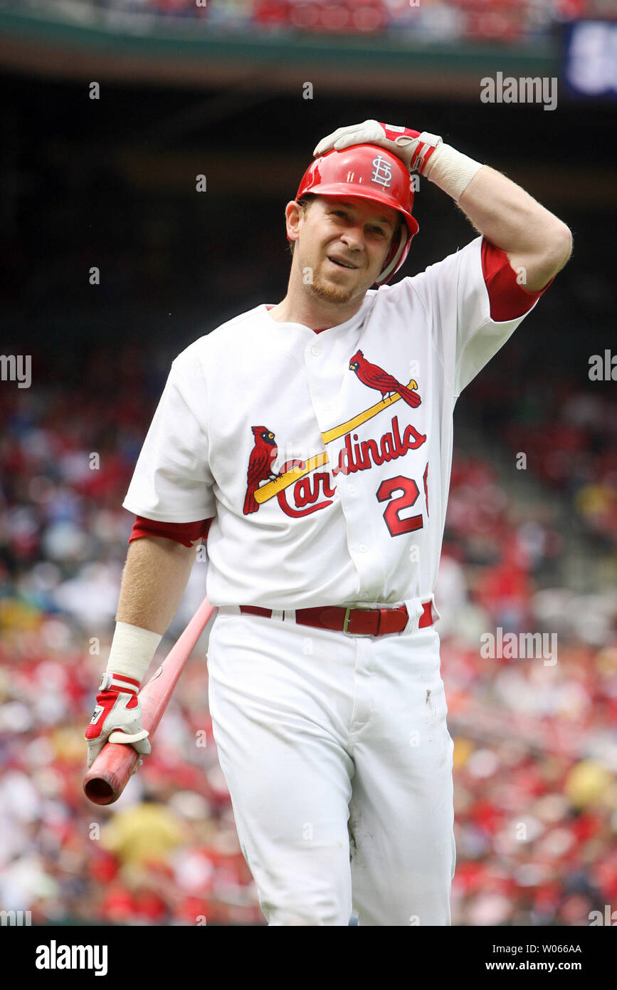 St. Louis Cardinals catcher Gary Bennett hits his helmet after popping ...