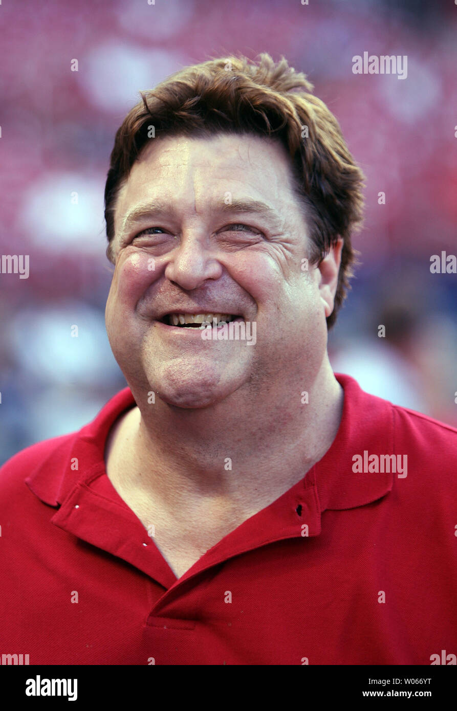 Actor John Goodman has fun during an interview on the field at Busch ...