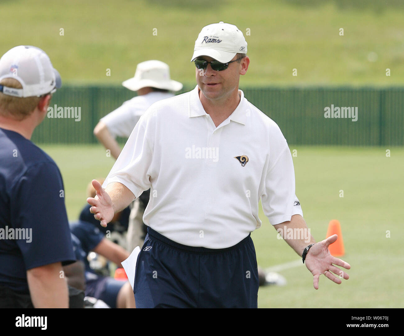 St. Louis Rams head football coach Scott Linehan talks with a staff ...
