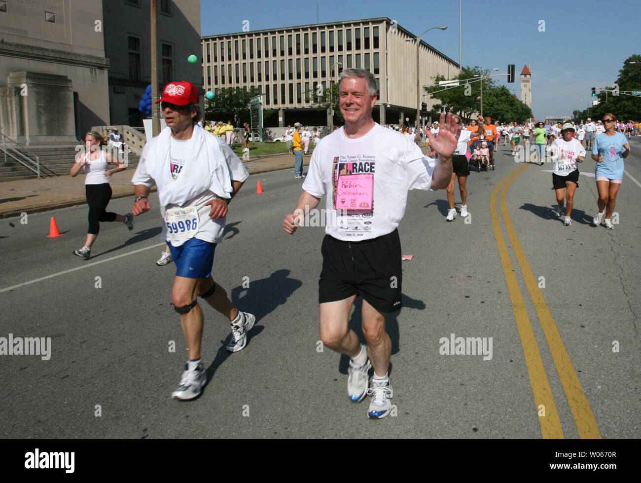 Missouri Lt. Gov. Peter Kinder (R) waves as he crosses the finish line ...