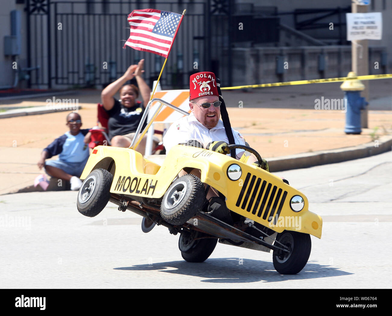 Jim the Moolah Shriner, entertains the crowds as he puts his go-cart up ...