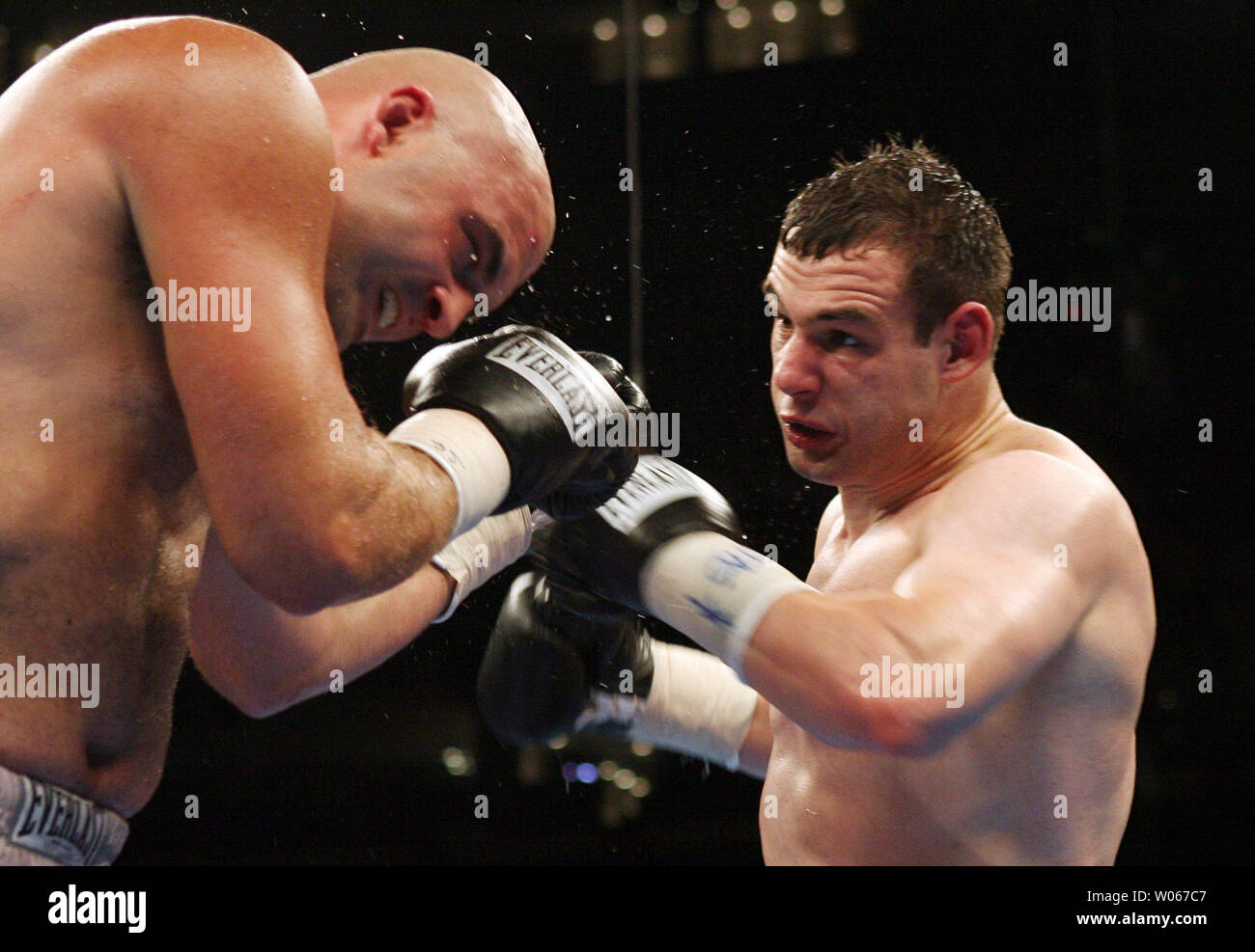 Mario Preskar of Zagreb, Croatia (R) delivers a punch to the face of ...