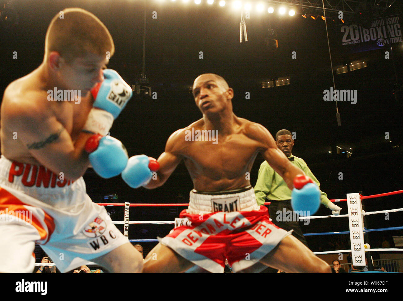 Devon Alexander (R) pounds on fighter Tyler Ziolkowski in the first ...