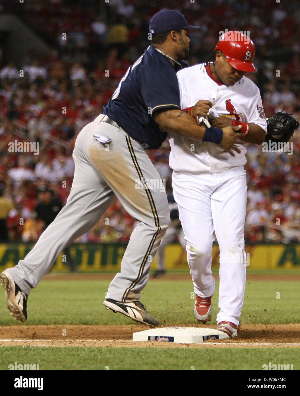 Milwaukee Brewers first baseman Prince Fielder (L) gets tangled up with ...