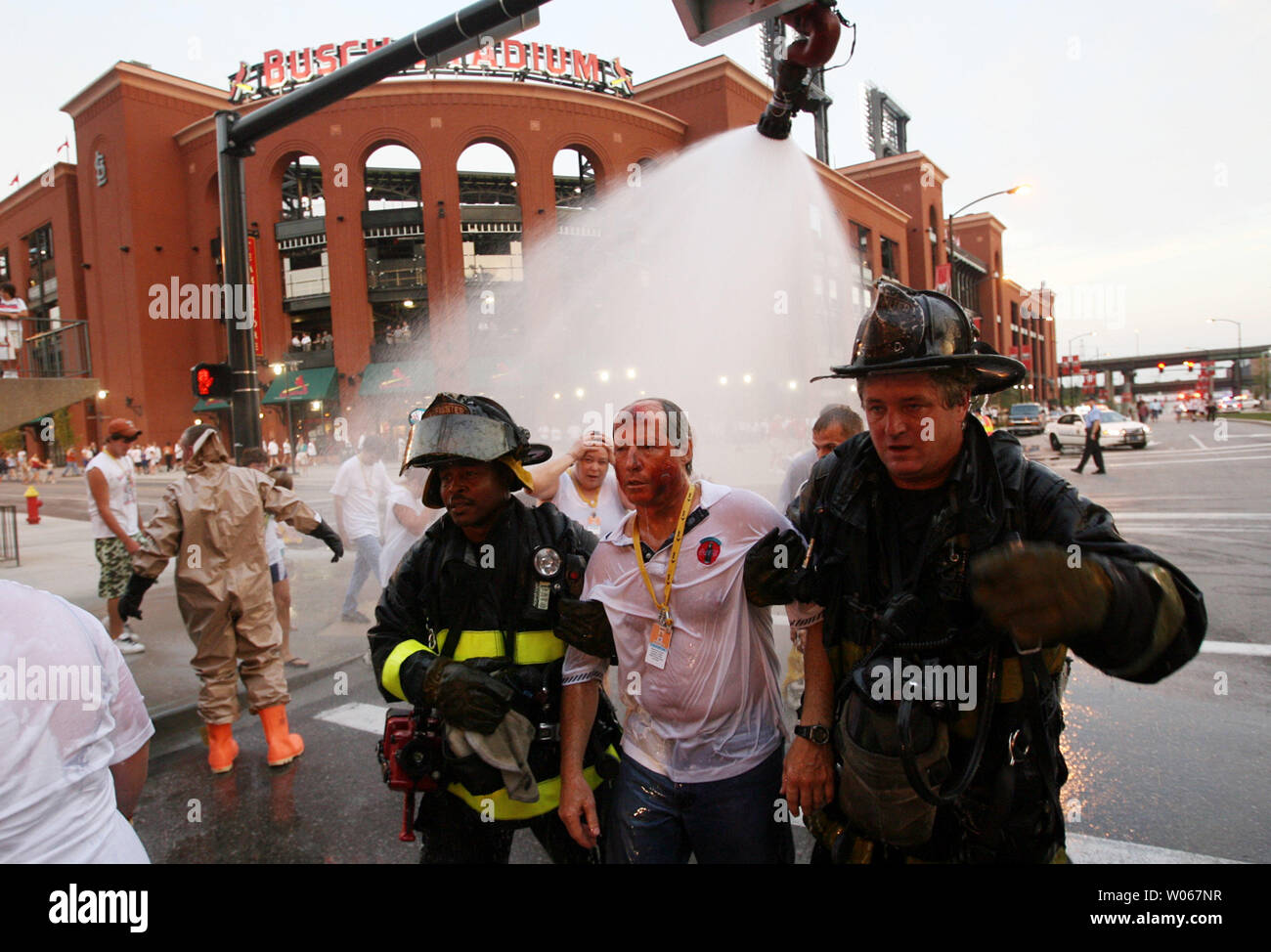 St. Louis firefighters walk an injured patient through a ...