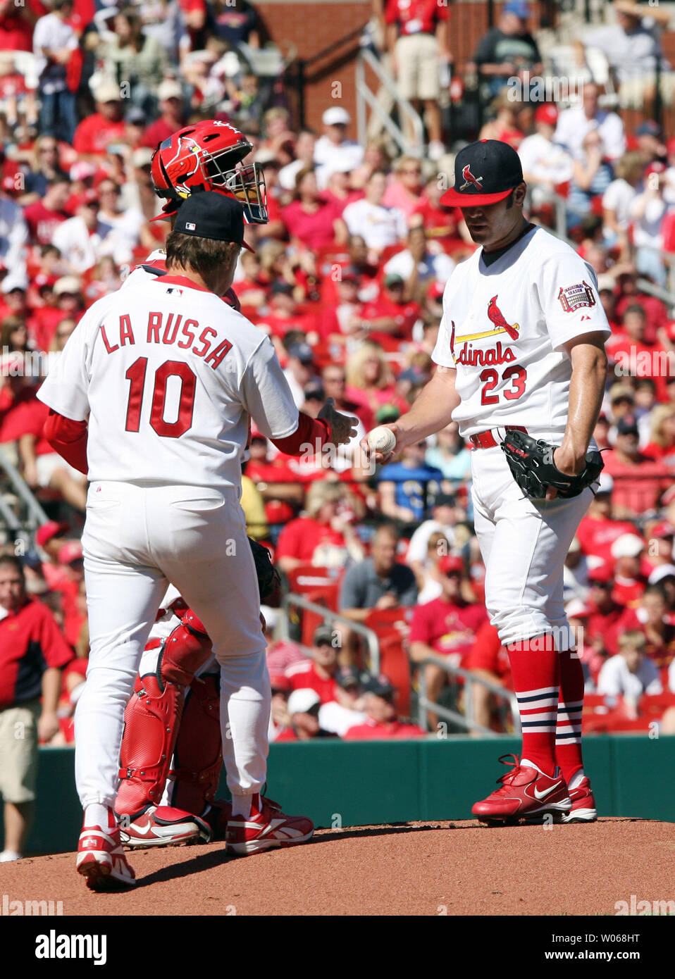 St. Louis Cardinals manager Tony La Russa takes the baseball from ...