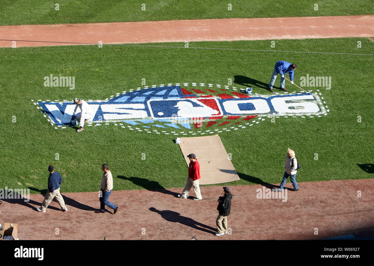 Visitors on a Busch Stadium tour look as Warren Sign Company employees ...