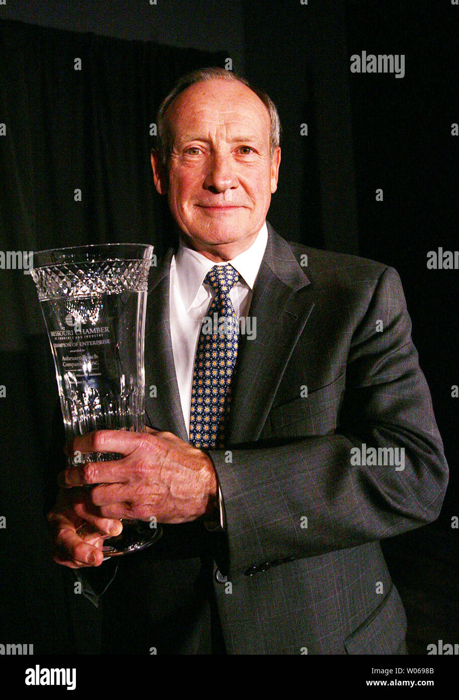 Patrick Stokes, President and CEO of Anheuser-Busch Companies, displays ...