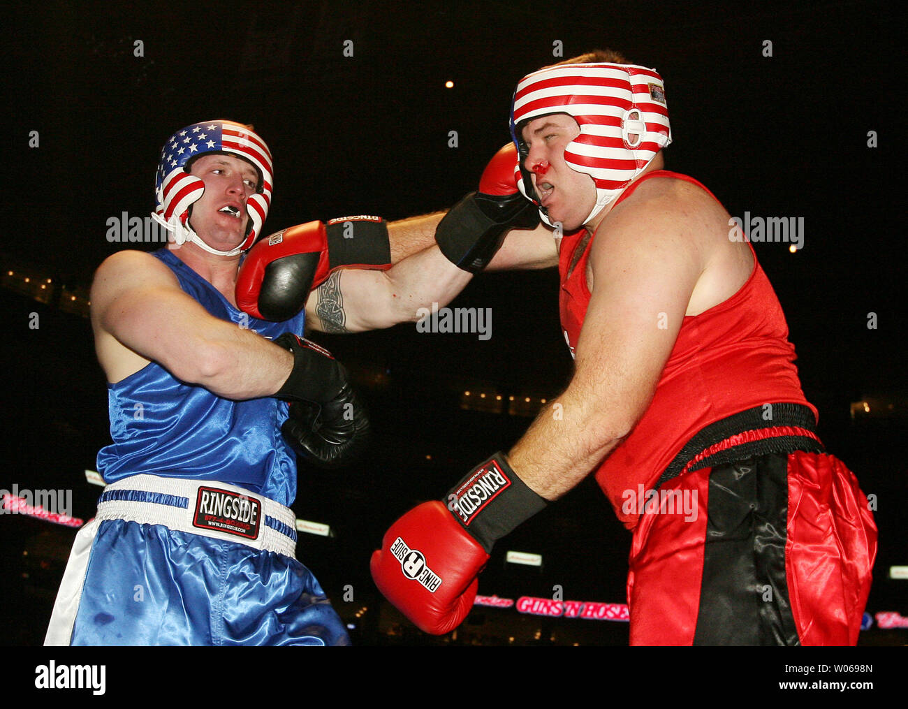 Josh Ziegler of the Lincoln, Missouri Sheriff's Department (L) connects ...