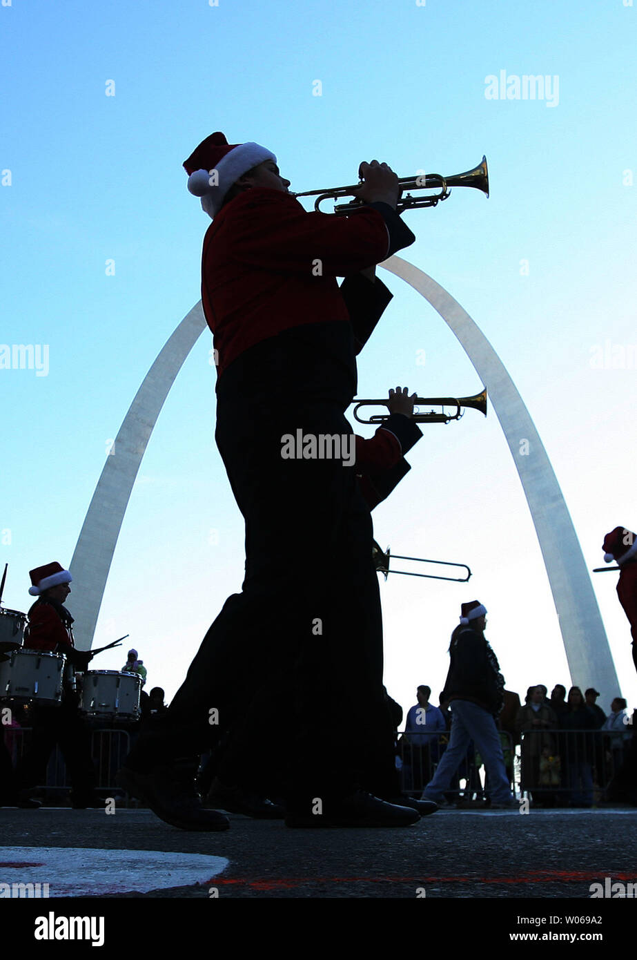 Members of the Bayless High School Marching Band proceed up Broadway ...
