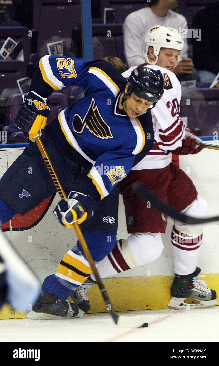 St. Louis Blues Bryce Salvador (27) takes the puck away from Phoenix ...