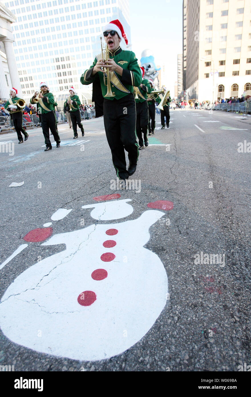 Members of the Bayless High School Marching Band make their way up ...