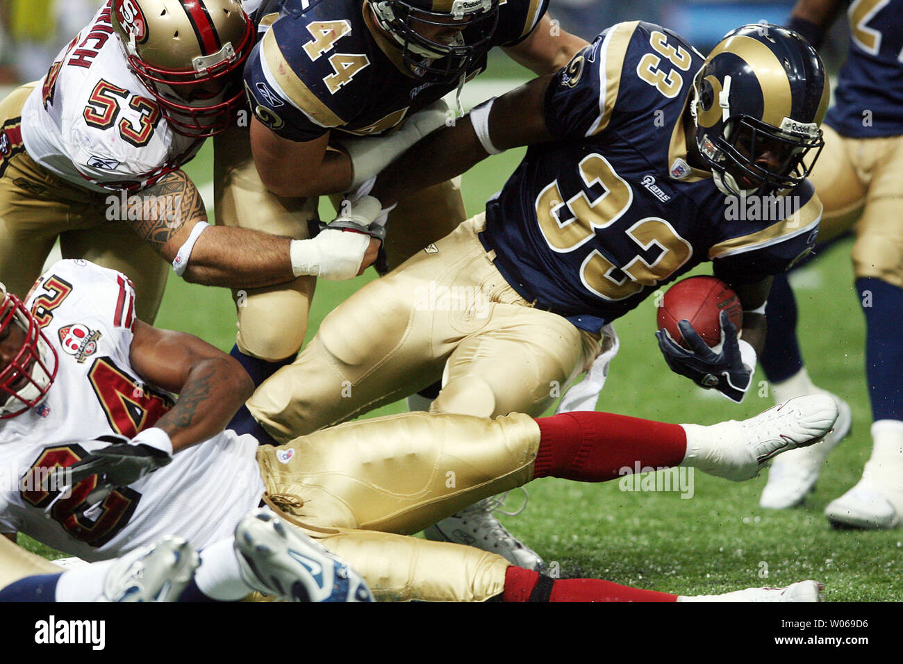 St. Louis Rams Kay-Jay Harris (33) lurches forward after being slowed ...