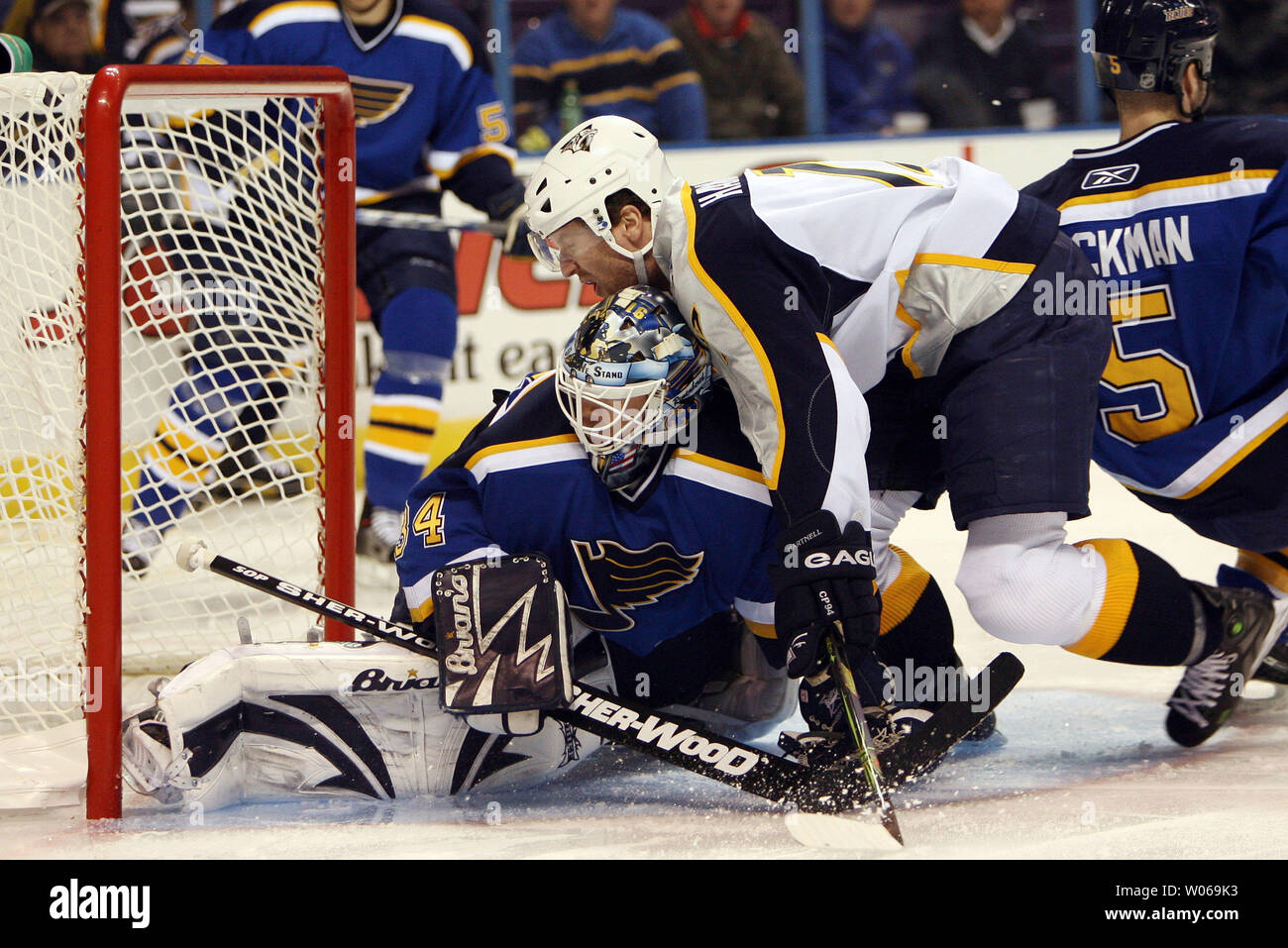 Nashville Predators Scott Hartnell (R) falls on top of St. Louis Blues ...