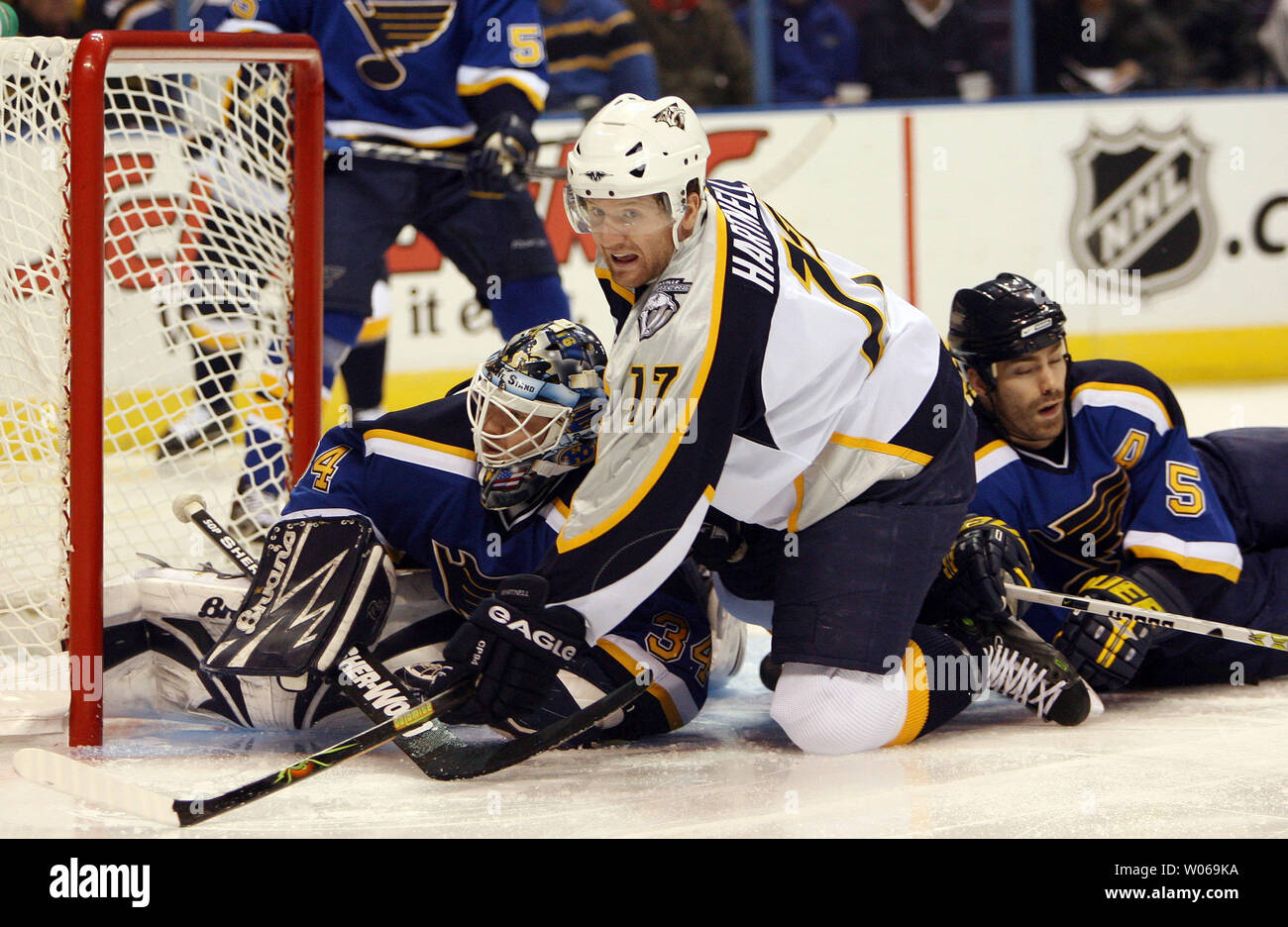 Nashville Predators Scott Hartnell (C) falls on top of St. Louis Blues ...