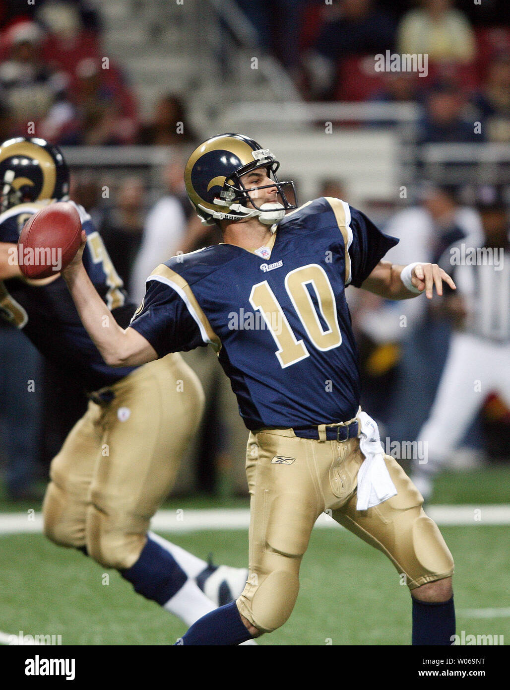 St. Louis Rams quarterback Marc Bulger rears back to throw the football ...