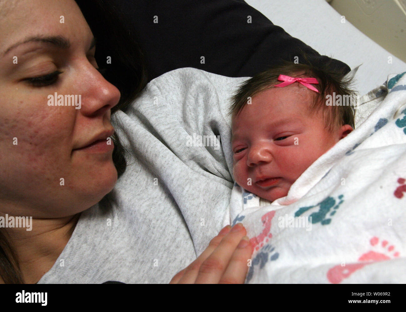 Kimberly Rizzo of St. Charles, Missouri gets a closer look at her new ...