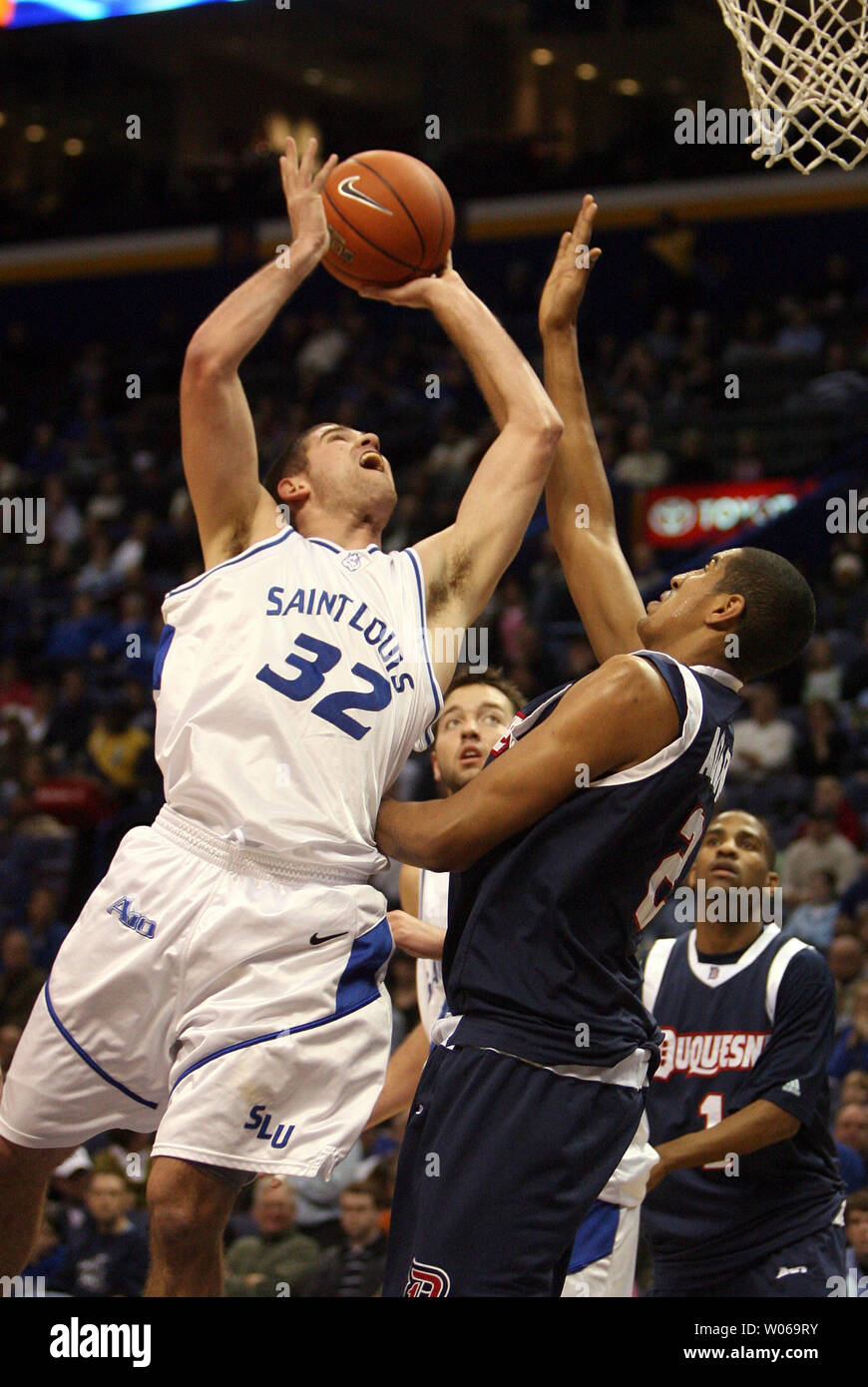 Saint Louis University Billikens Luke Meyer (32) shoots over Duquesne ...
