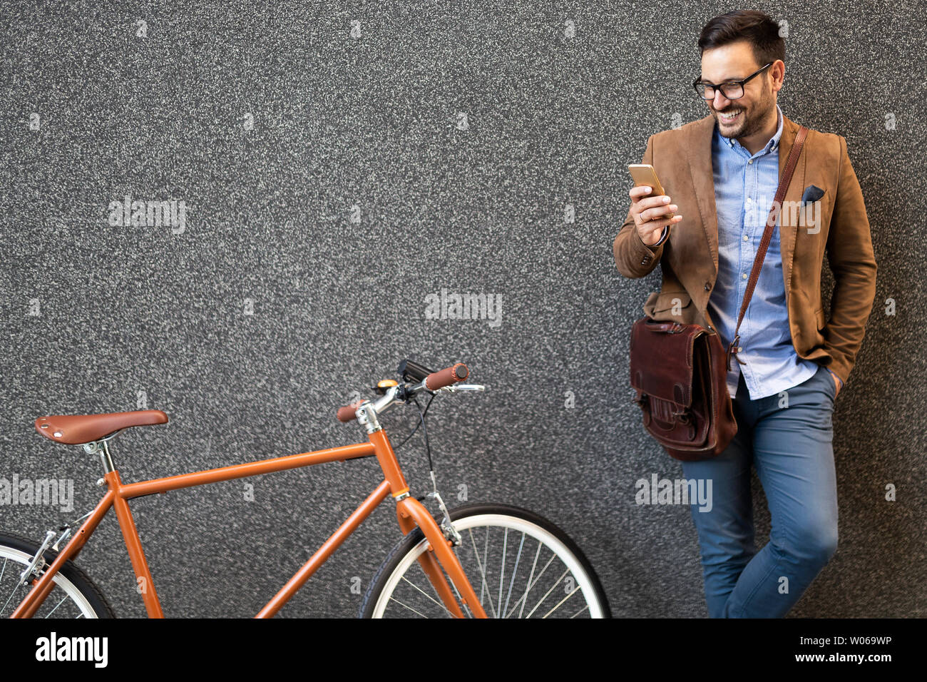 Happy businessman riding bicycle to work in morning Stock Photo - Alamy