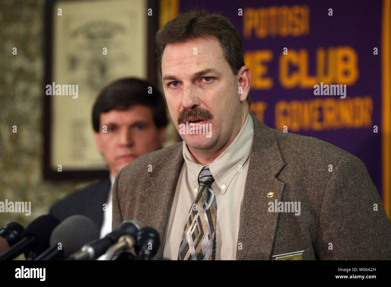 Washington County Sheriff Kevin Schroeder (R) reads new charges against Michael J. Devlin in the ...