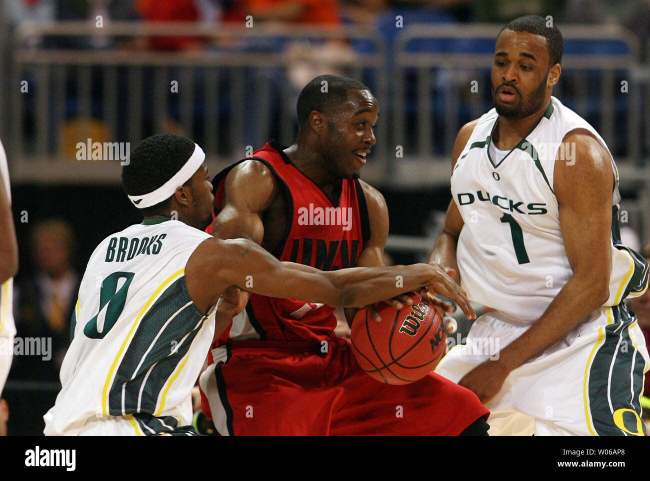 Oregon Ducks Aaron Brooks (L) strips the basketball from the hands of ...