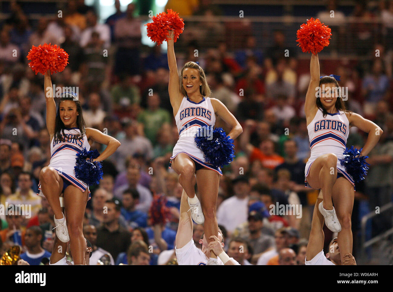 Florida Gators cheerleaders cheer for their team in the first half ...