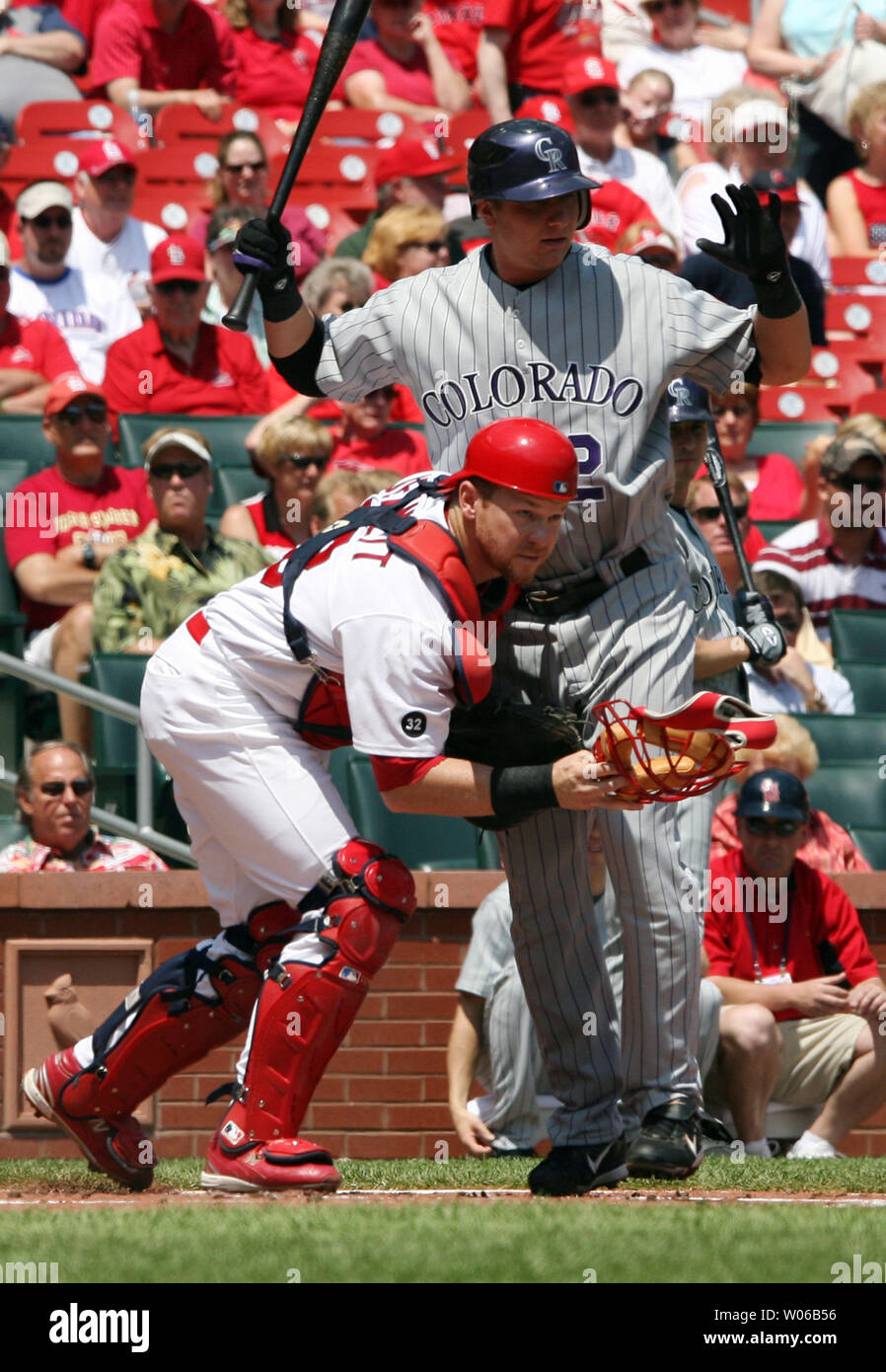St. Louis Cardinals catcher Gary Bennett pushes Colorado Rockies Steve ...