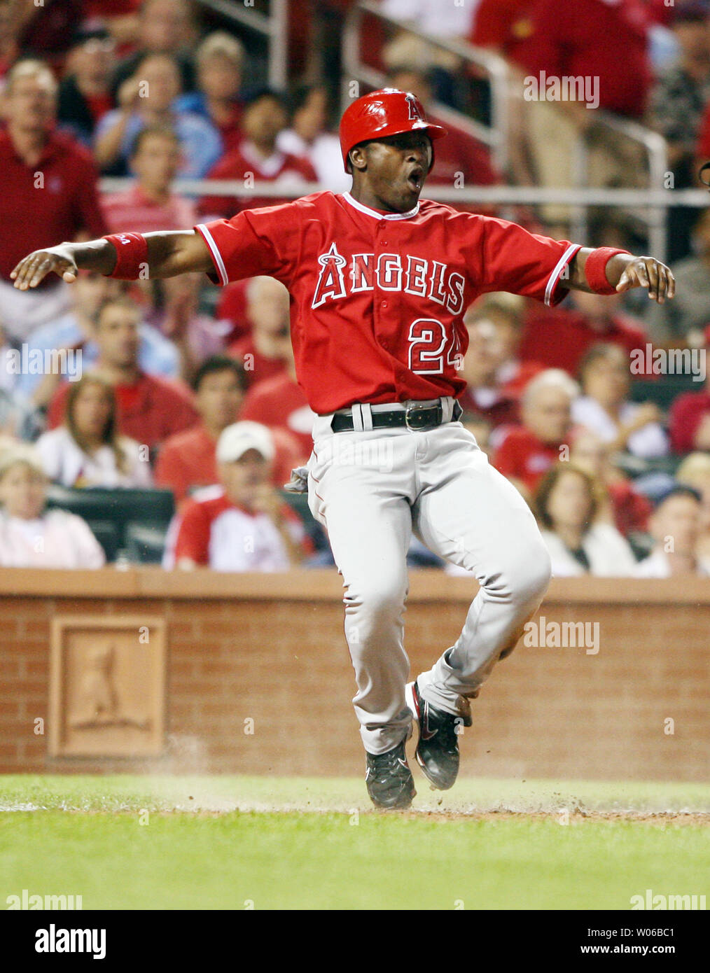 Los Angeles Angels Gary Matthews signals safe after sliding into home ...