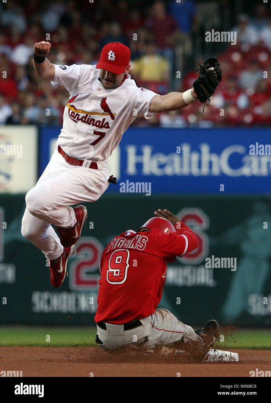 Los Angeles Angels Chone Figgins covers up to avoid the leaping St ...