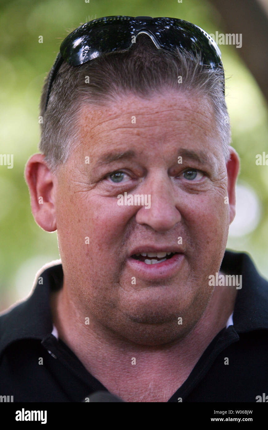 Notre Dame's head football coach Charlie Weis talks with reporters ...
