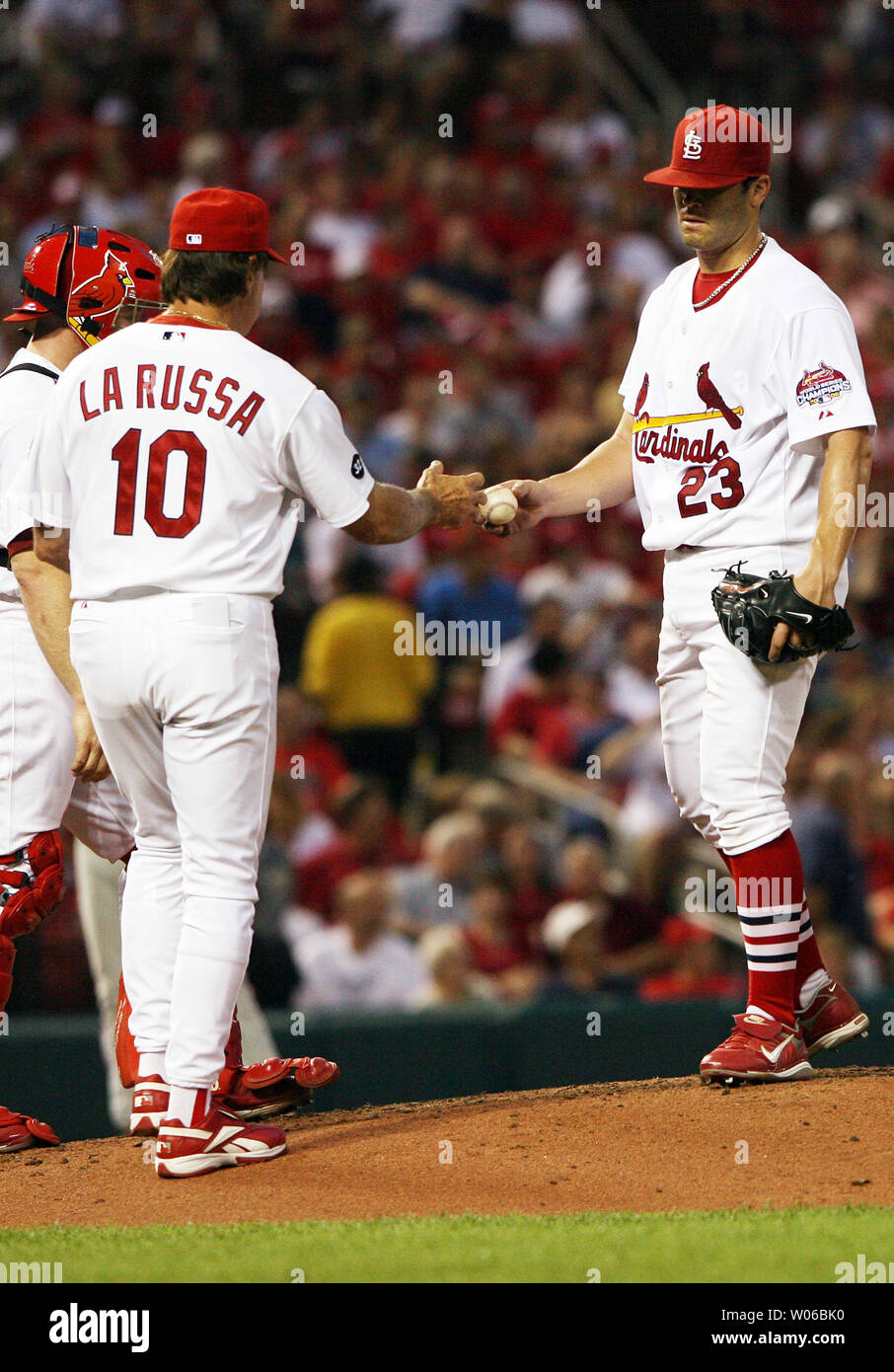 St. Louis Cardinals manager Tony La Russa takes the baseball from ...