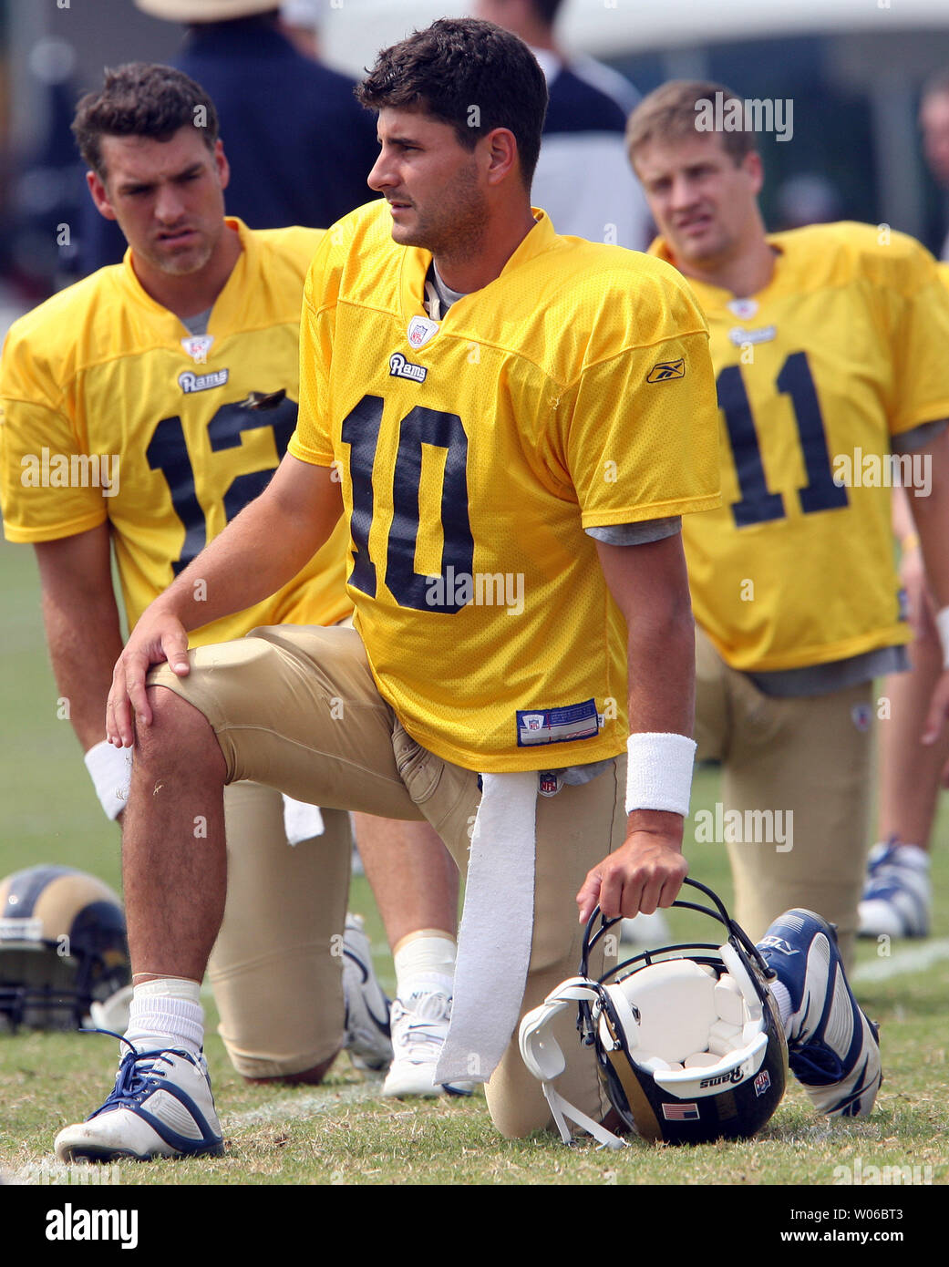 St. Louis Rams quarterbacks Marc Bulger (10), Gus Freotte (12), and ...