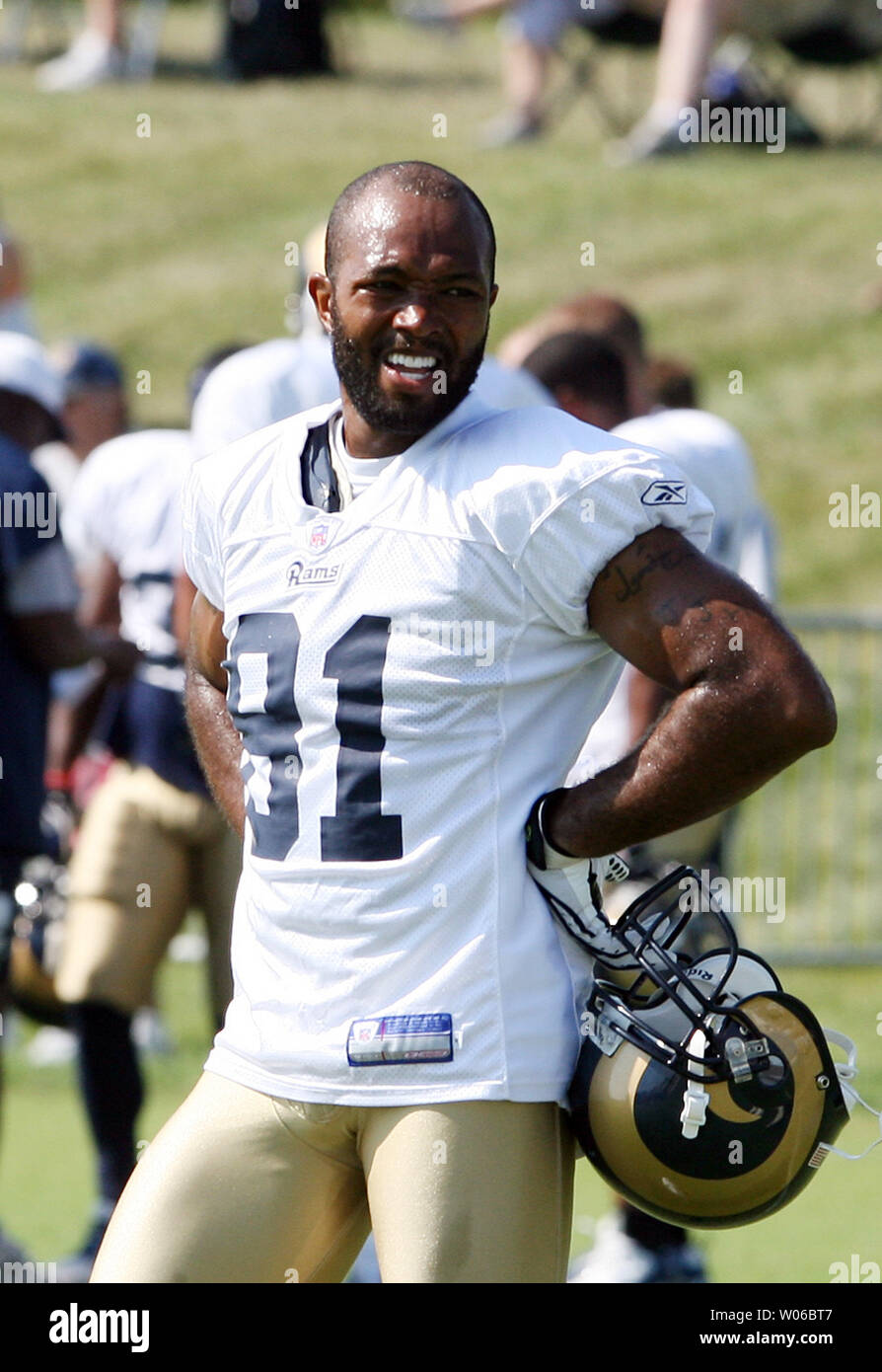 St. Louis Rams Torry Holt takes a breather during training camp at the ...