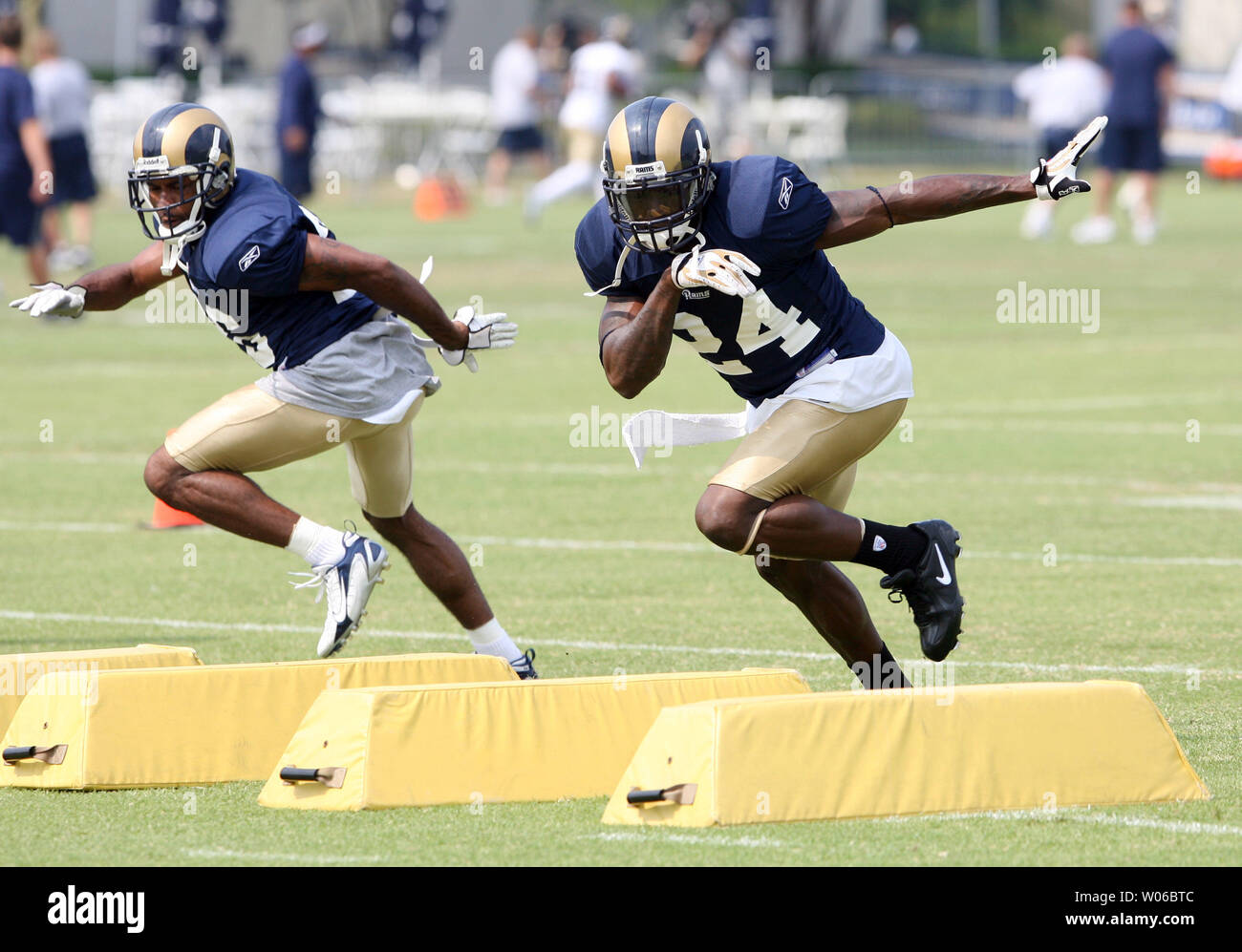 St. Louis Rams Ty Hill (L) and Ron Bartell practice running during ...