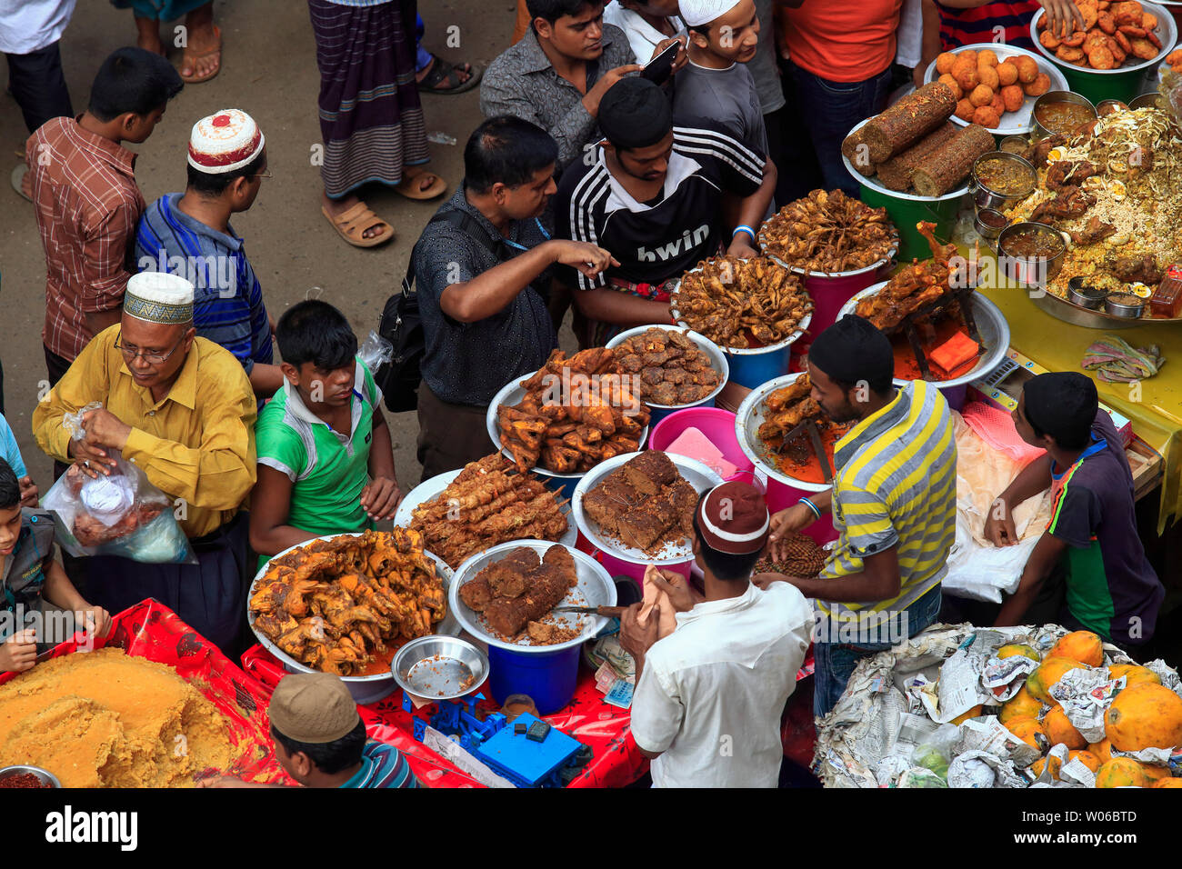 Chawk Bazar iftar market of Dhaka is well known for traditional spicy foods. Thousands of people ...