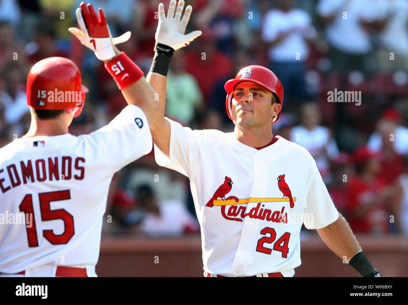 St. Louis Cardinals Jim Edmonds (L) celebrates the second home run of ...