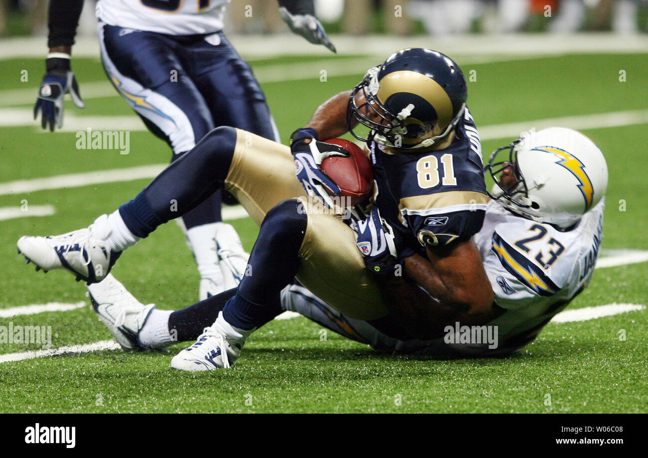 San Diego Chargers Quentin Jammer (23) pulls St. Louis Rams Torry Holt ...