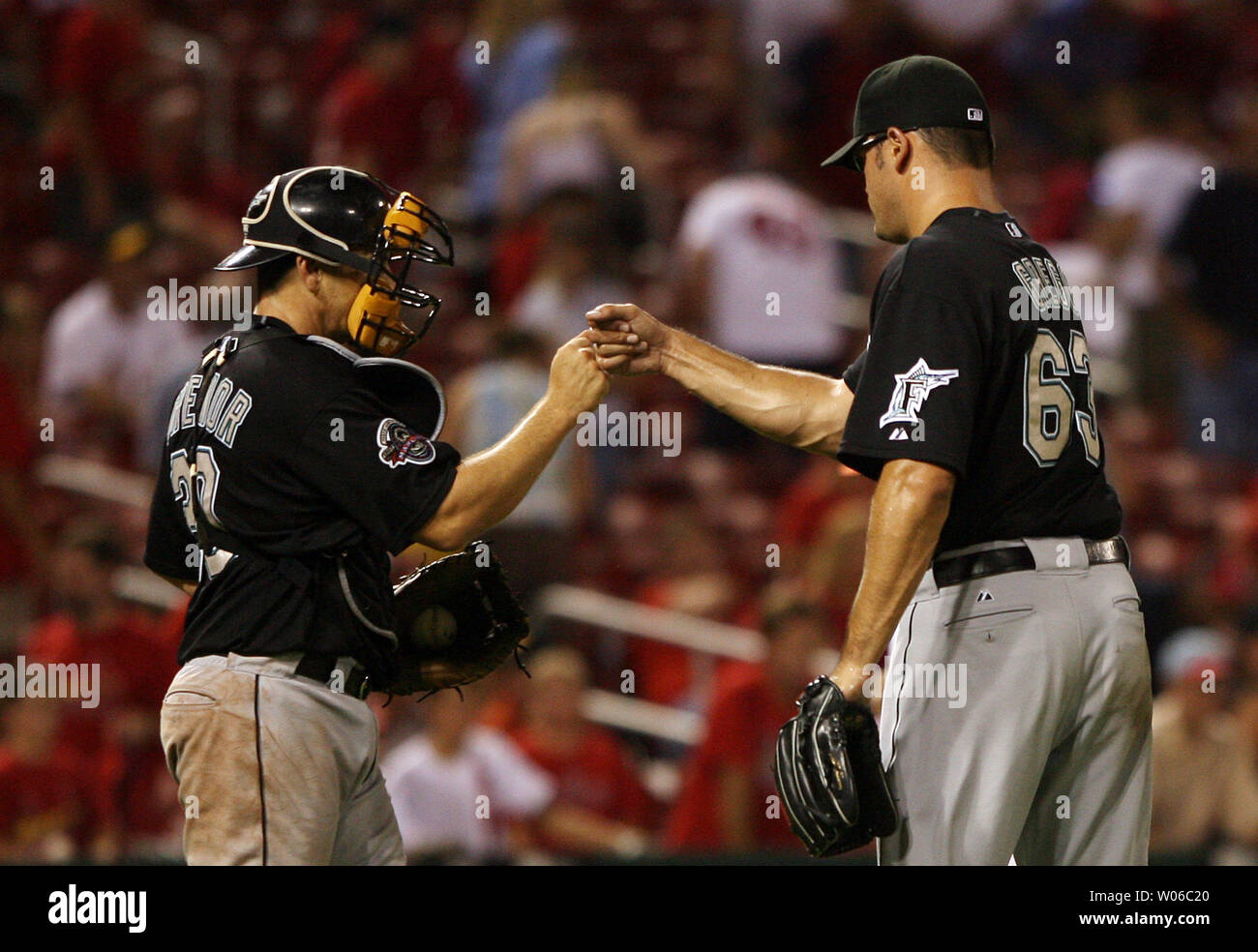 Florida Marlins Matt Treanor (L) congratulates pitcher Kevin Gregg ...