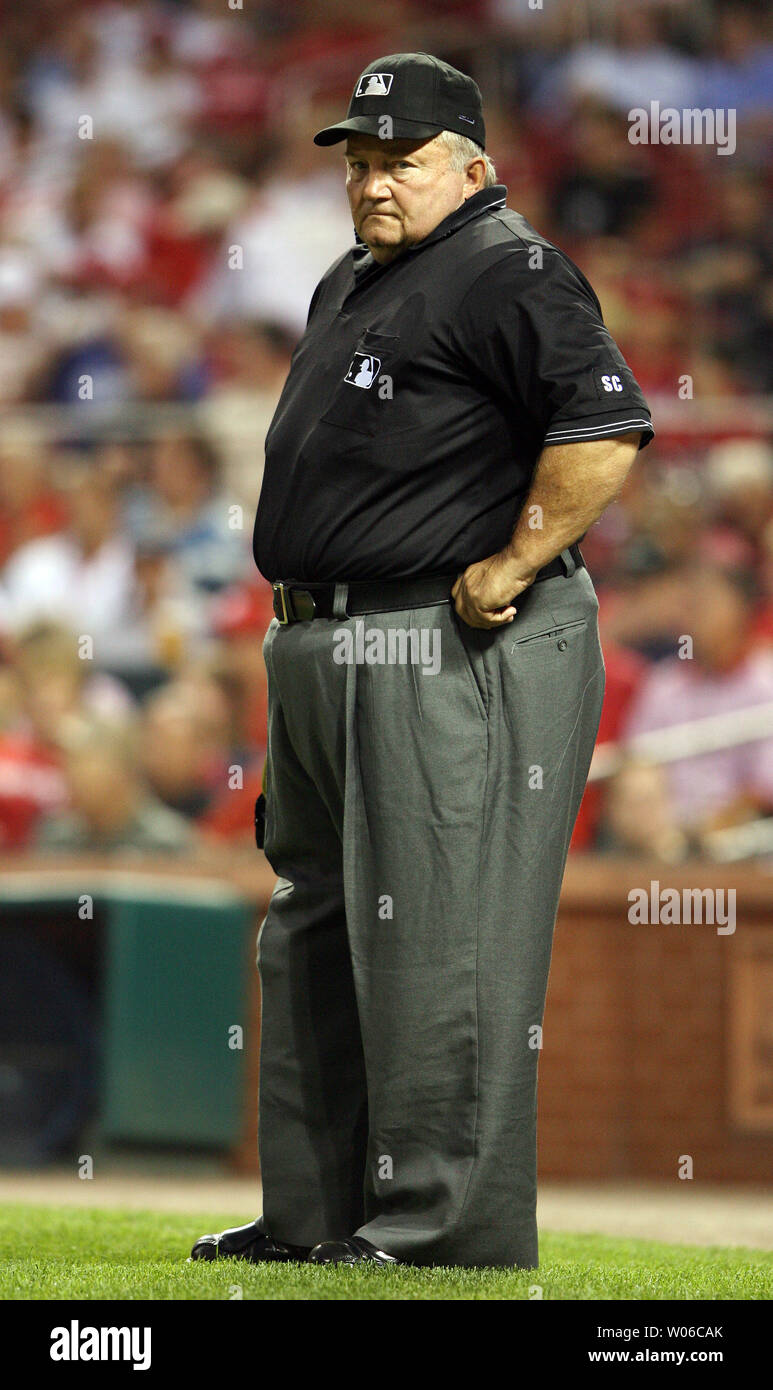 Home plate umpire Bruce Froemming watches the crowd between innings ...