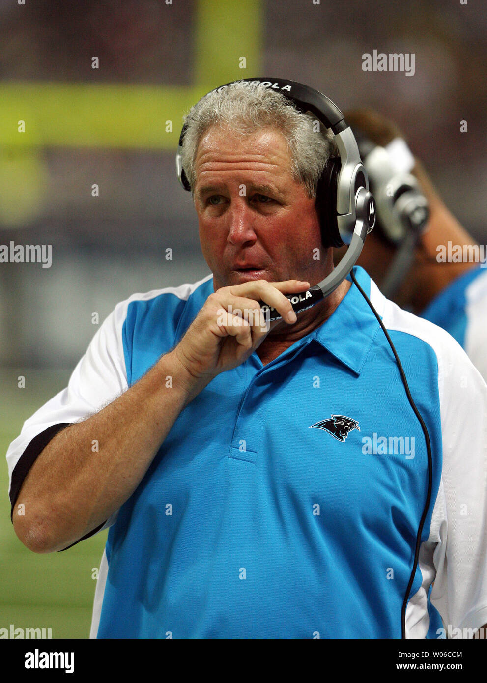 Carolina Panthers head football coach John Fox talks on his headset ...