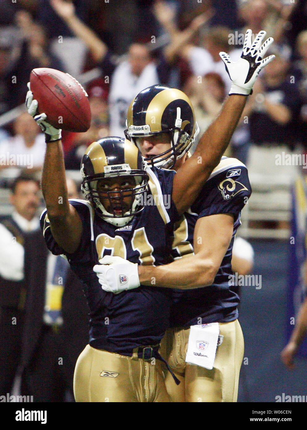 St. Louis Rams Torry Holt (81) gets a hug from teammate Drew Bennett ...