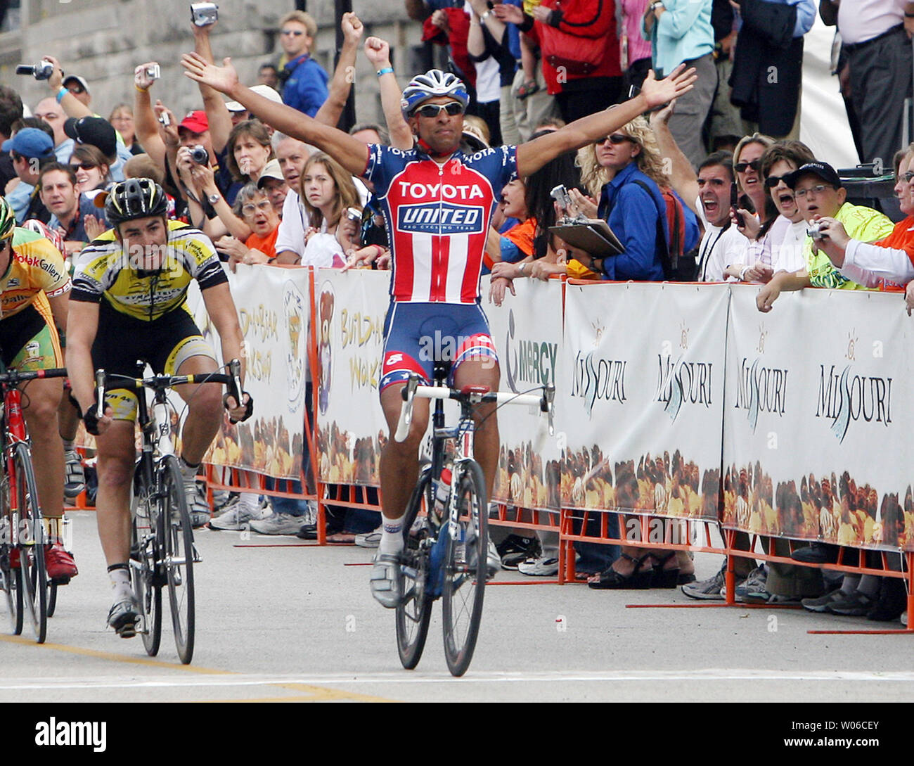 Ivan Dominguez of Cuba raises his arms as he wins stage six of the Tour ...