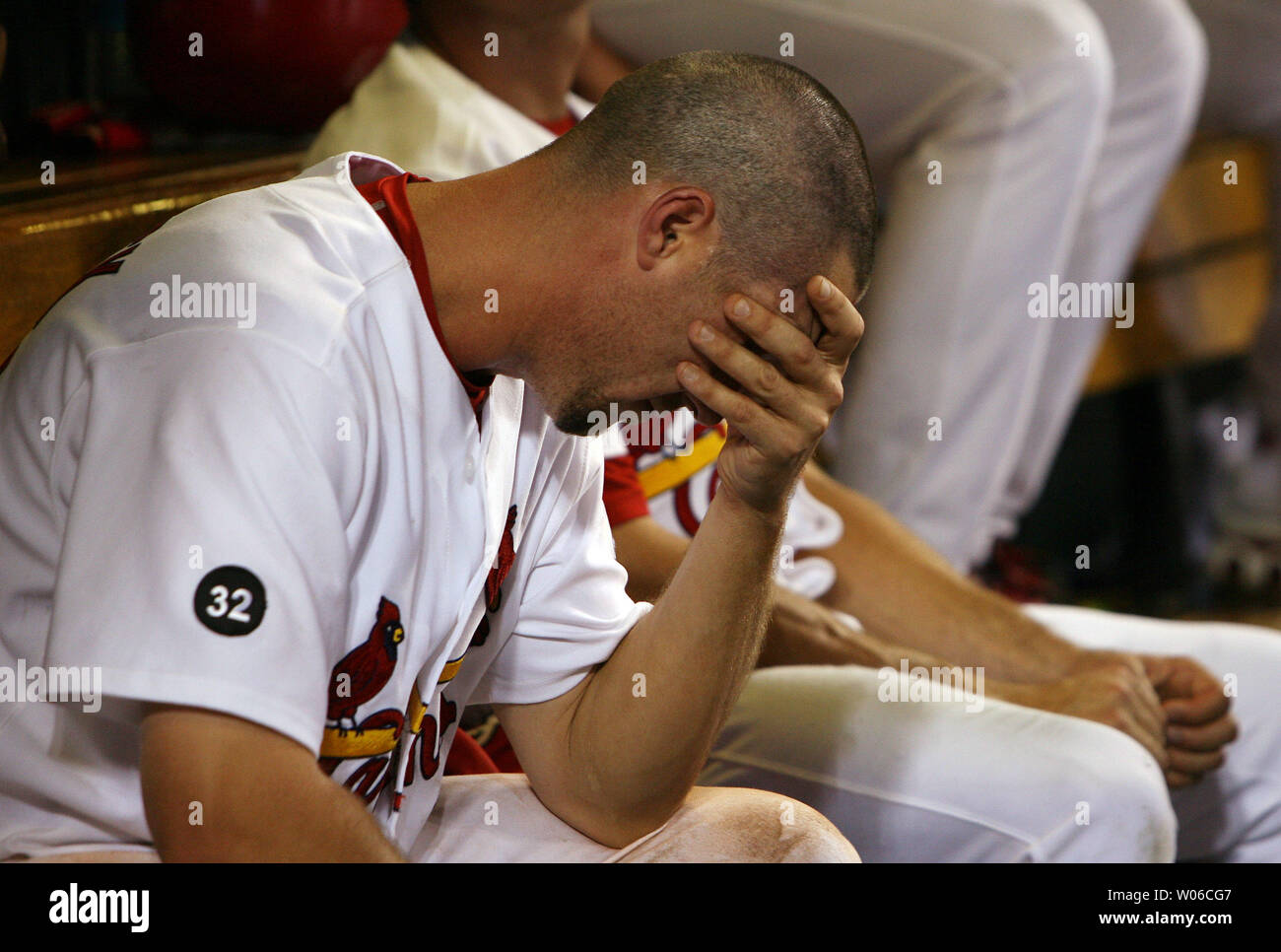 St. Louis Cardinals Ryan Ludwick covers his face as the third out is ...