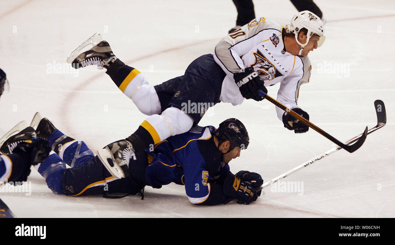 Nashville Predators Martin Erat (10) trips over St. Louis Blues Barret ...