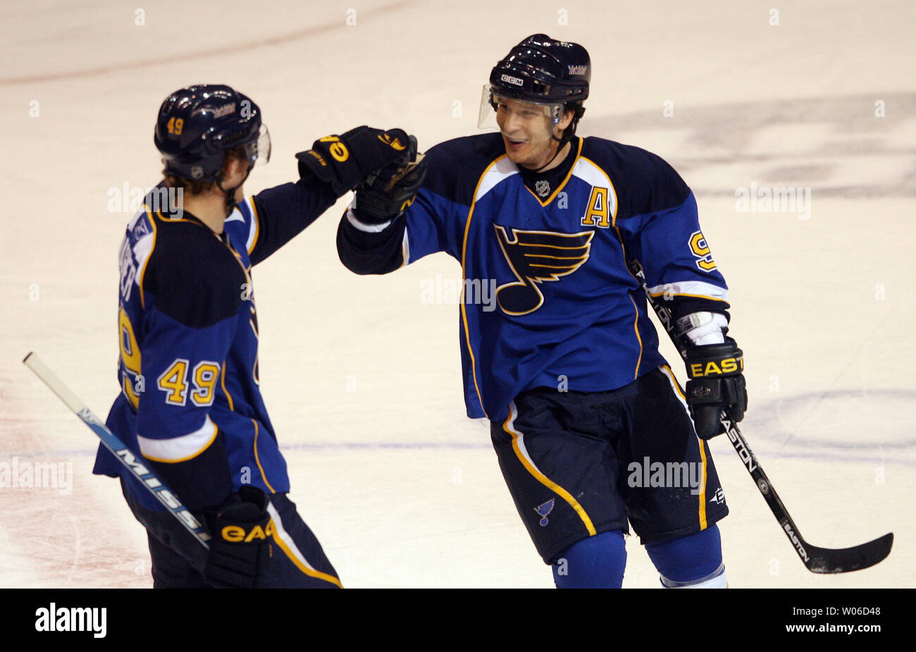 St. Louis Blues Paul Kariya (R) is congratulated by teammate Steve ...