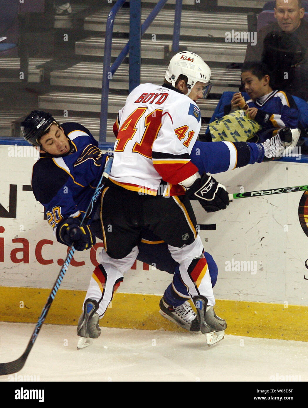 Calgary Flames Dustin Boyd (41) puts St. Louis Blues Mike Johnson into ...