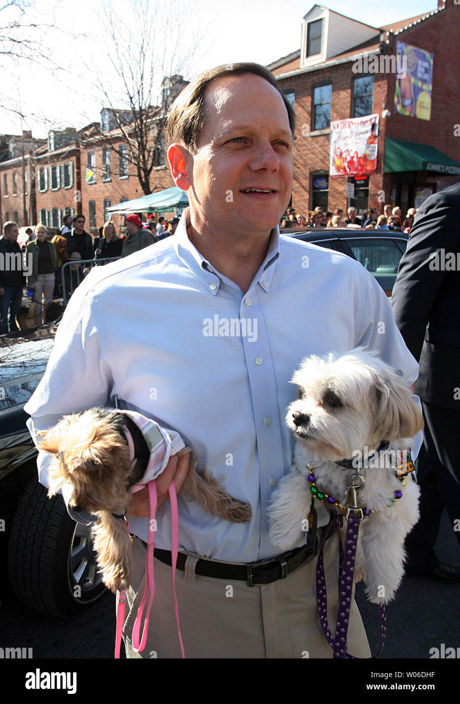St. Louis Mayor Francis Slay holds his dogs Mia (L) and Riley at the ...