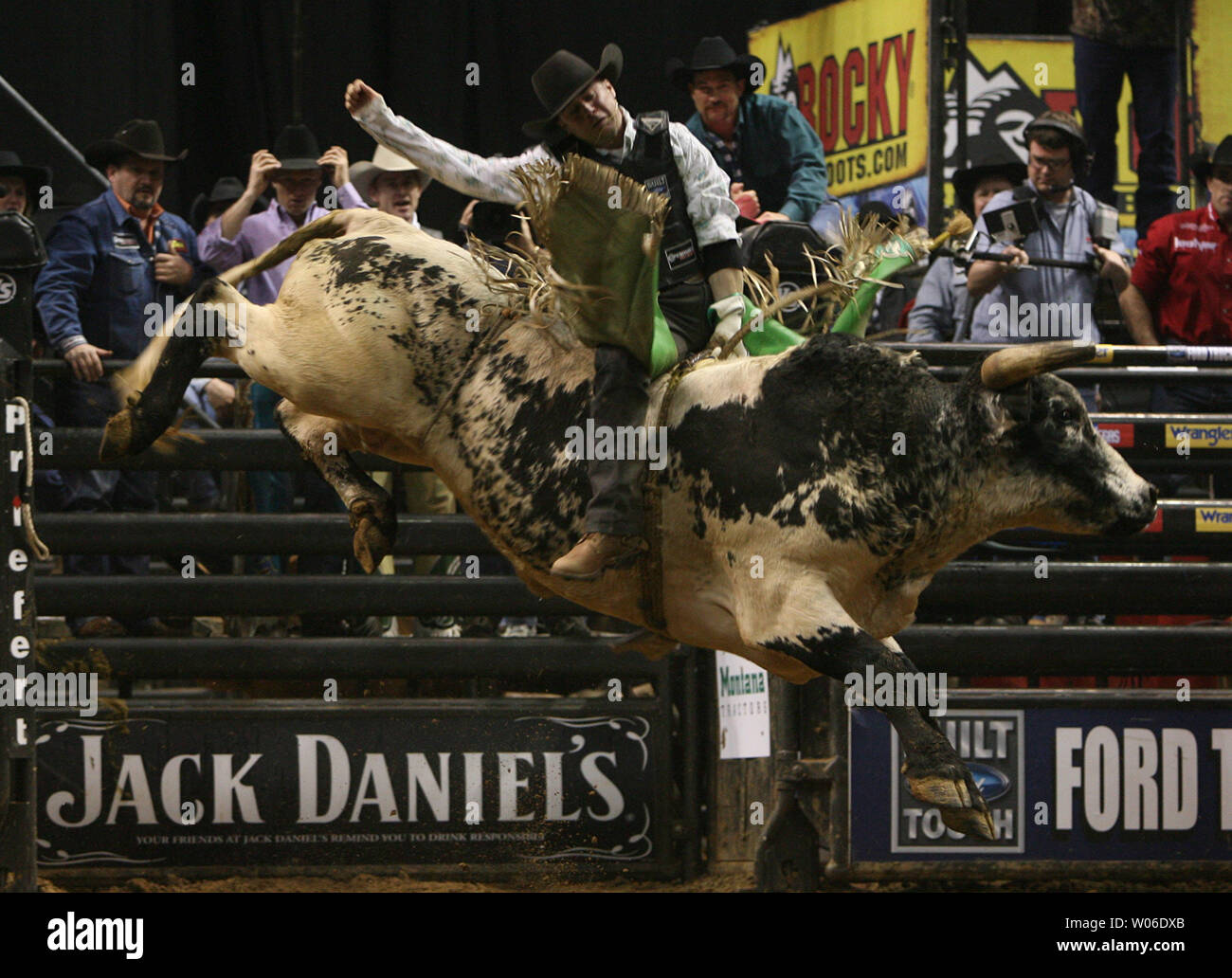Bryan Richardson of Dallas goes airborn aboard Scaredy Cat the bull ...